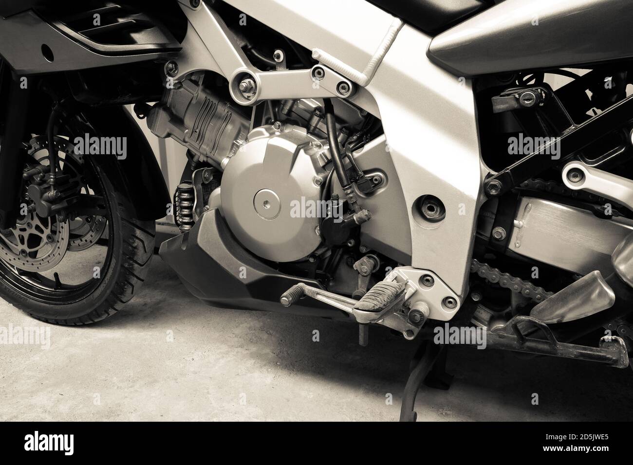 Silver engine of sports motorcycle close-up. Chain, gearbox, front ...