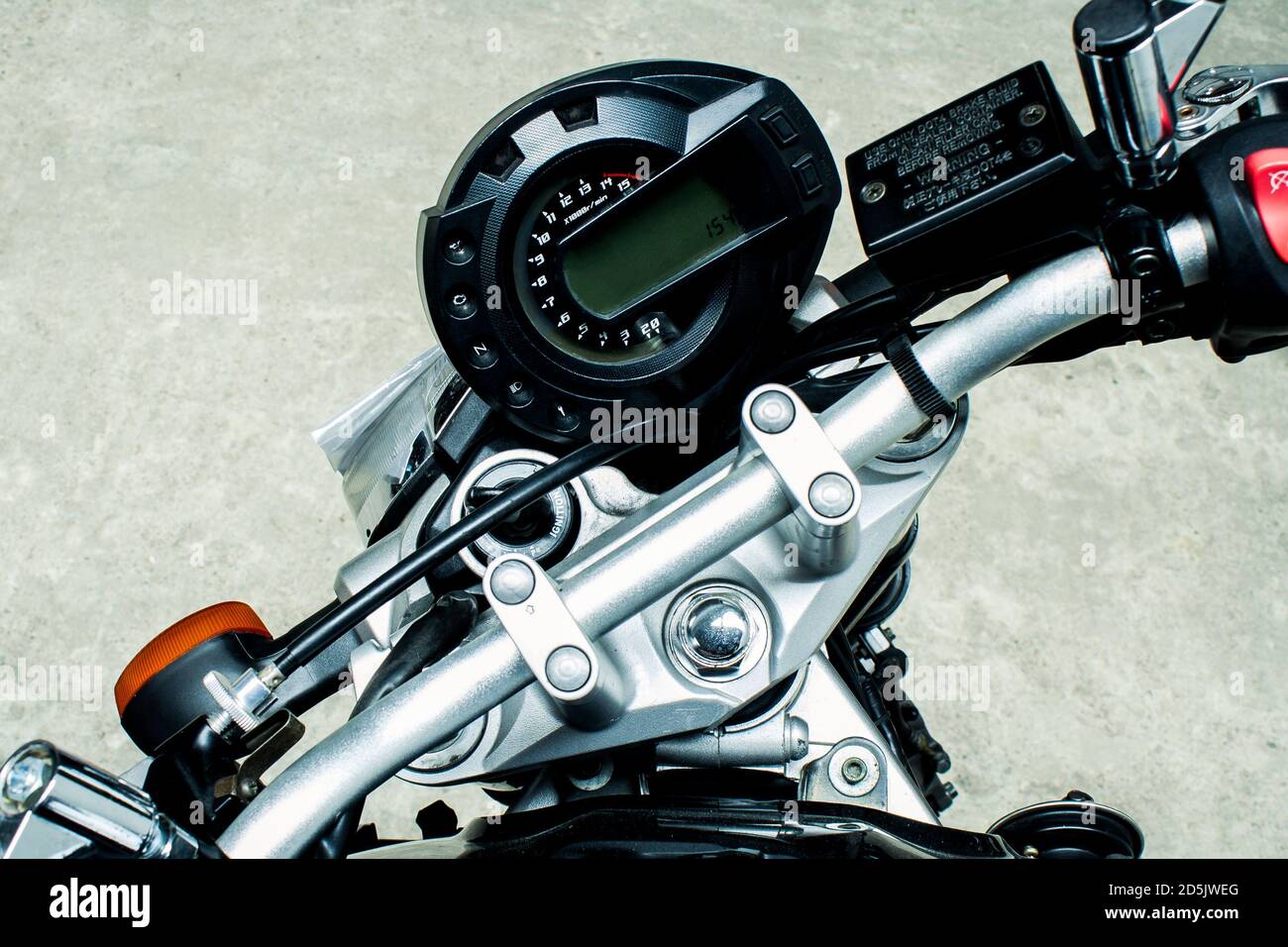 Combined electronic speedometer and dial tachometer on the steering ...