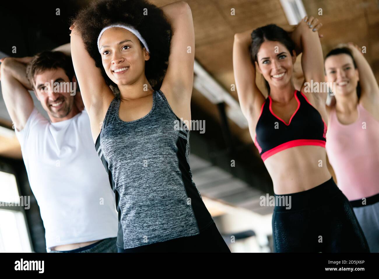 Team workout in gym to reach goals Stock Photo - Alamy