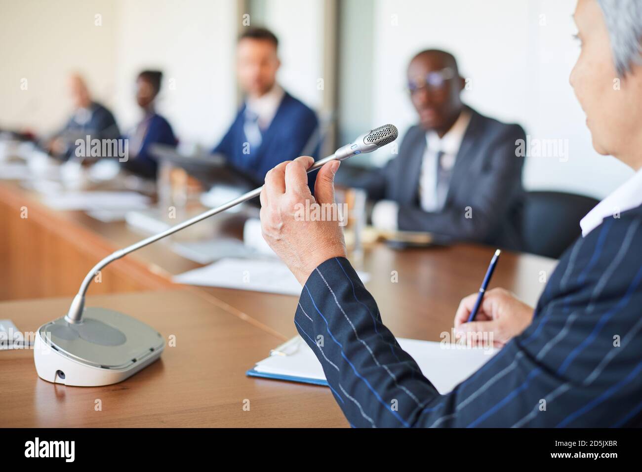 Sitting communication microphone leadership smiling hi-res stock ...