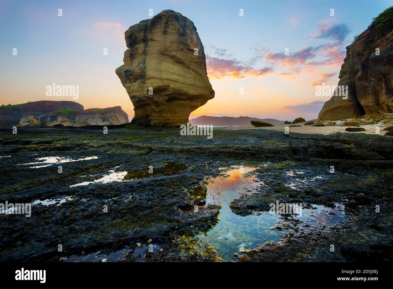 Sunset at the Umbrella stone in Lombok Stock Photo - Alamy