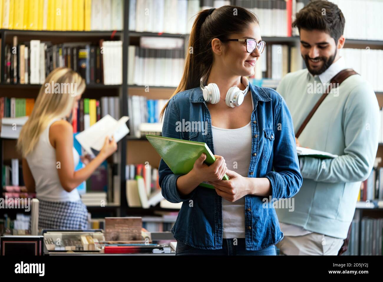 Group of college students studying in the school library Stock Photo ...