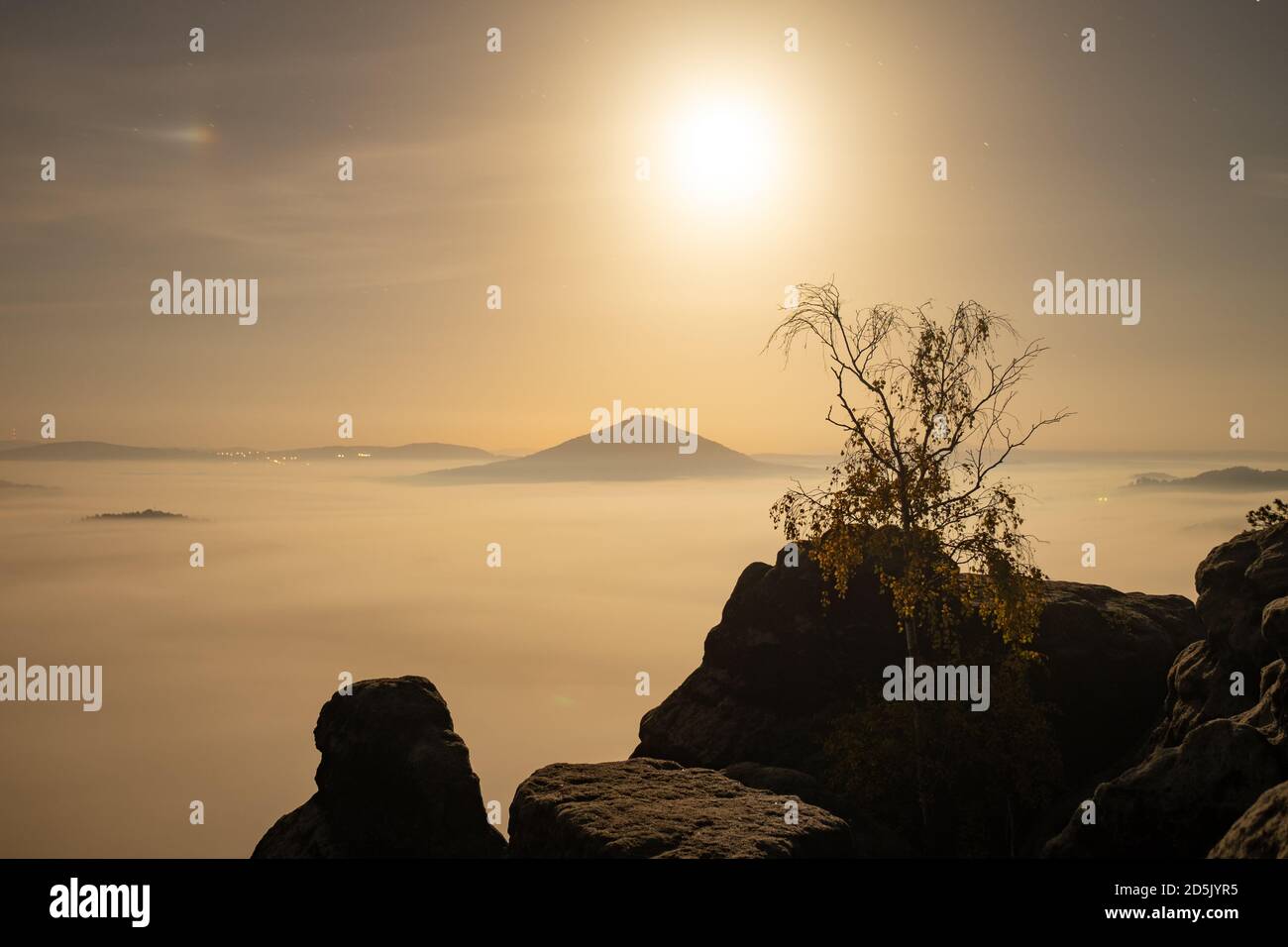 Mystical autumn night with misty land and hills in fog. Beautiful ...