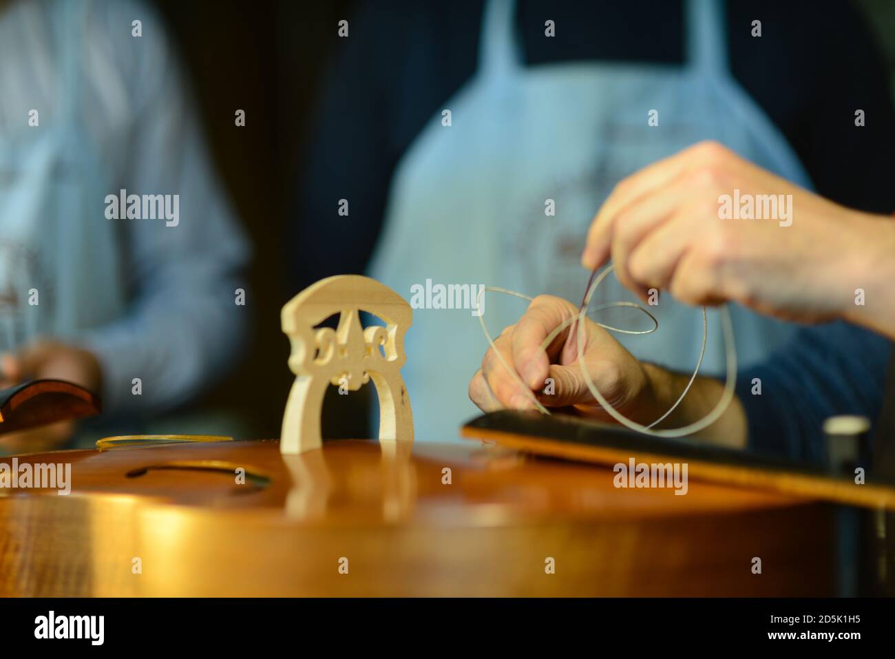 Violin maker at work in his workshop and bench Stock Photo - Alamy