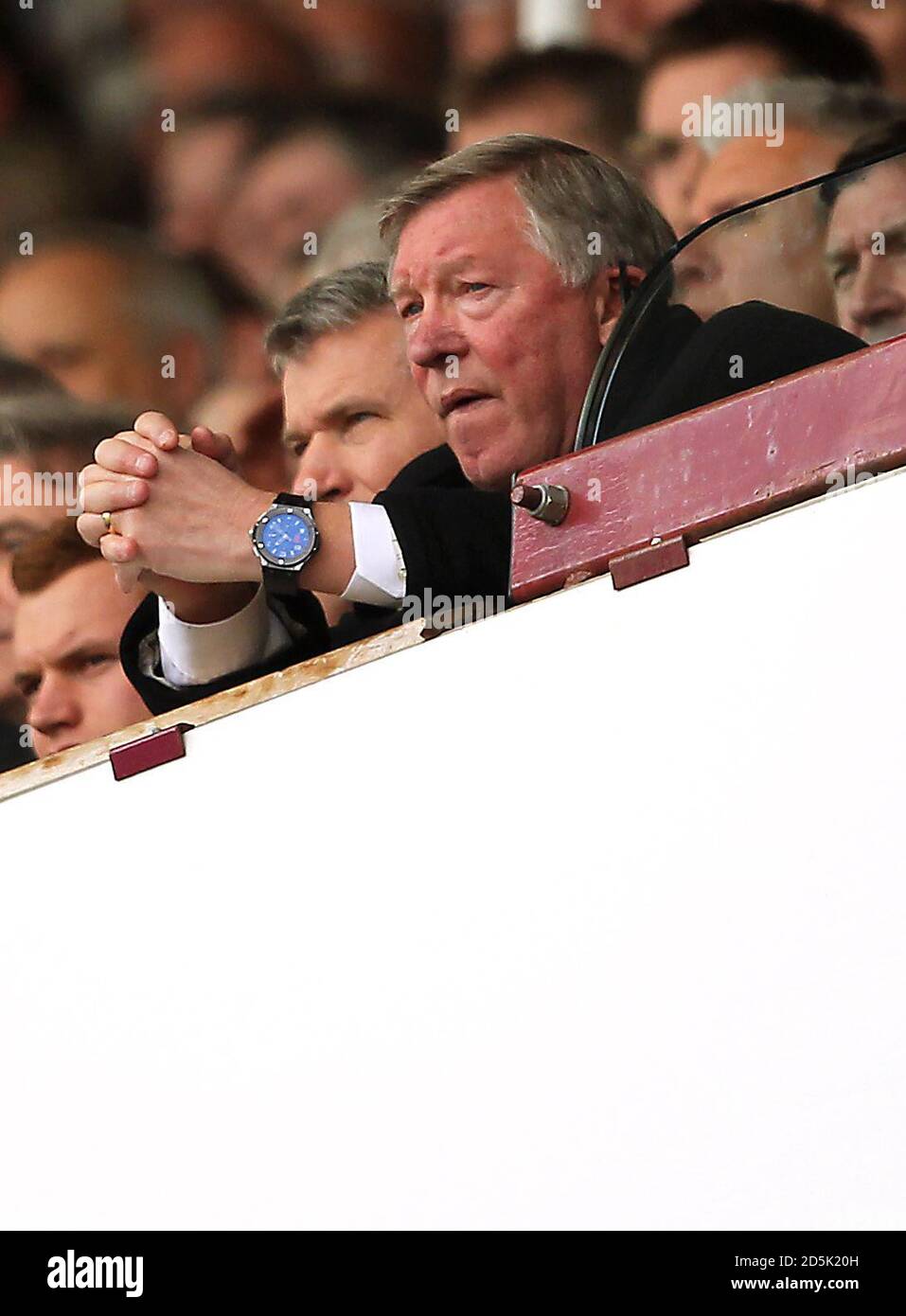 Manchester United's manager Alex Ferguson looks on from the stand as he ...