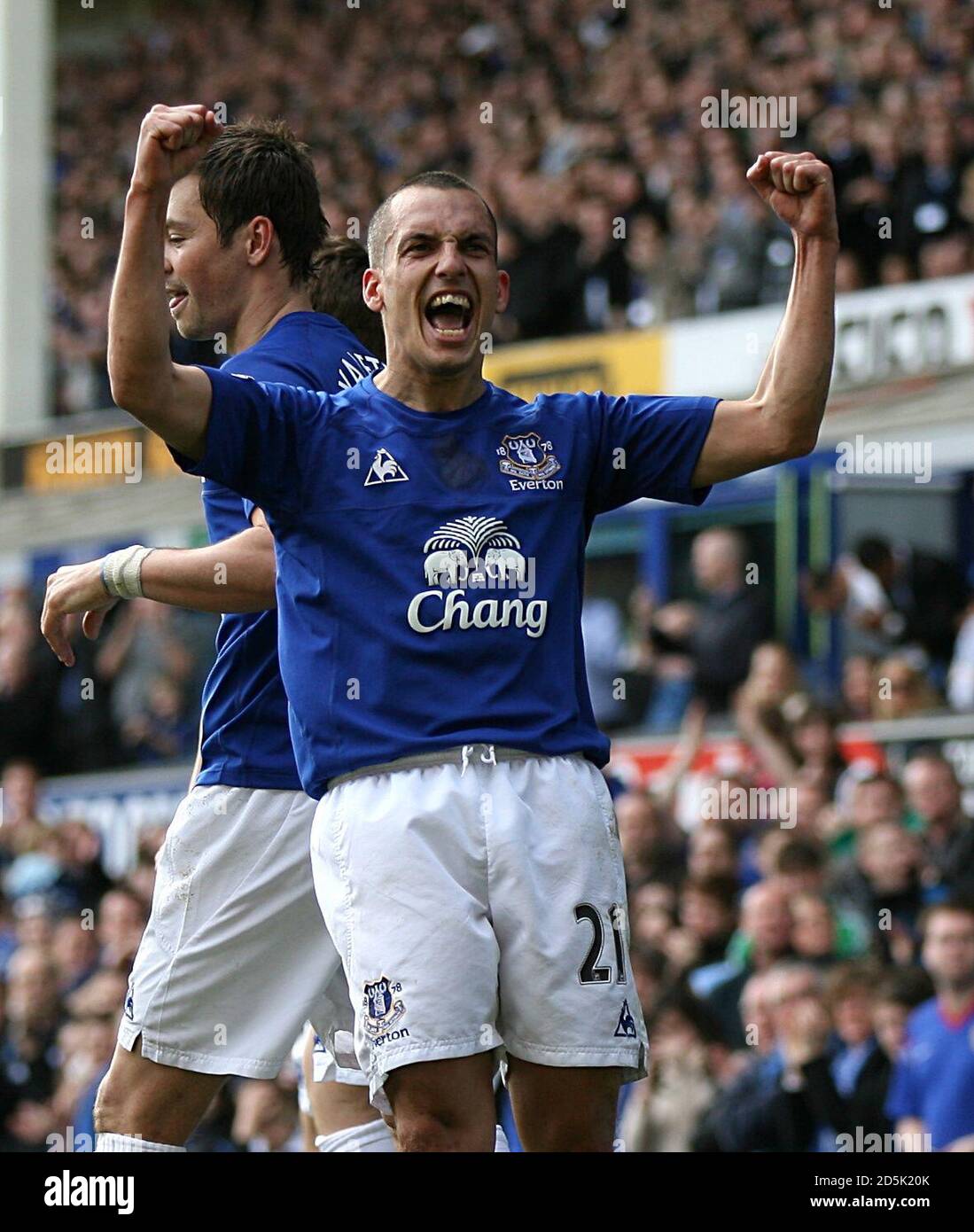 Everton's Leon Osman celebrates scoring the opening goal of the game ...