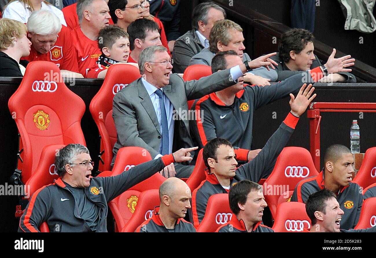 Manchester United manager Alex Ferguson (centre) gestures from the ...
