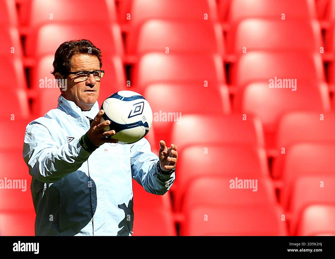 England manager Fabio Capello throws the ball during a training session ...