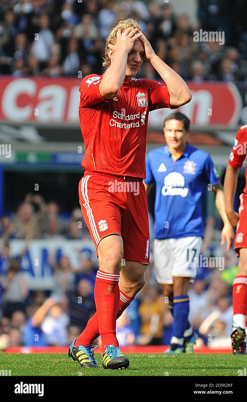 Liverpool's Dirk Kuyt shows his dejection after seeing his penalty ...