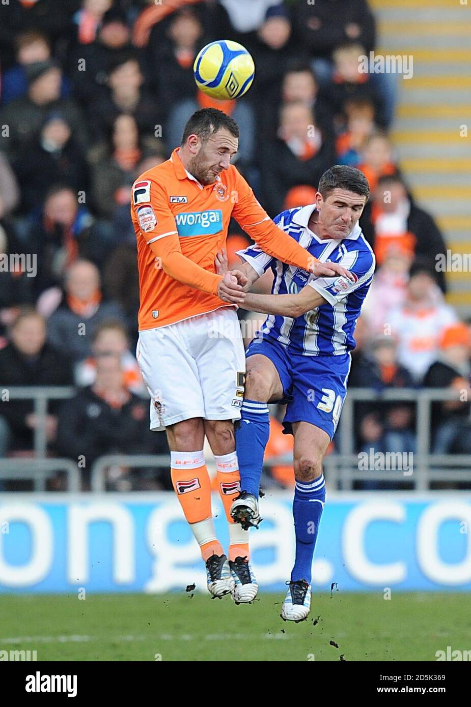 Blackpool's Neal Eardley (left) and Sheffield Wednesday's Ryan Lowe ...