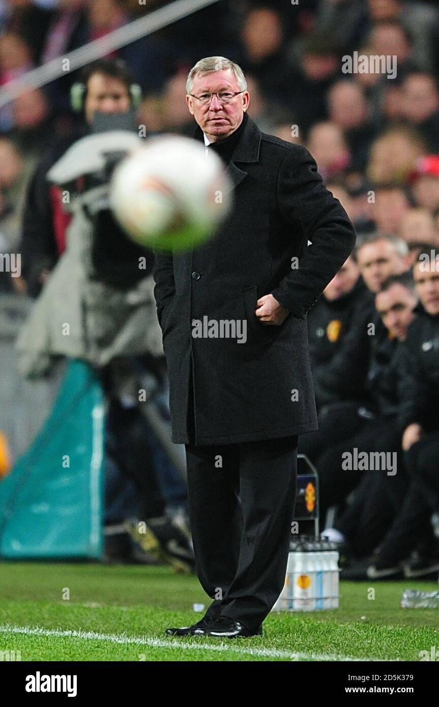 Sir alex ferguson watches the action from the touchline hi-res stock ...