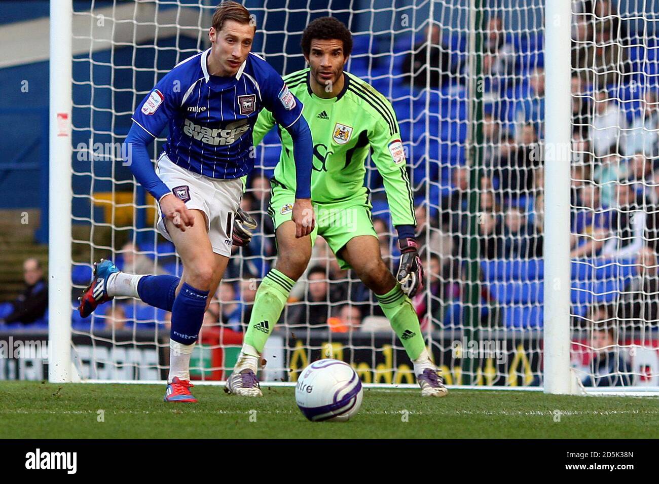 Ipswich Town's Lee Martin chases a ball watched by Bristol City's ...