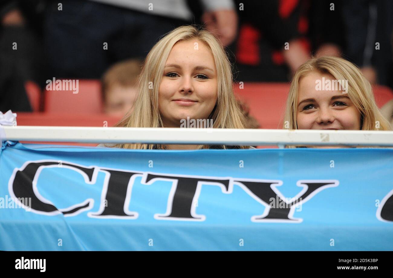 Female Manchester City fans cheer on their side in the stands Stock ...