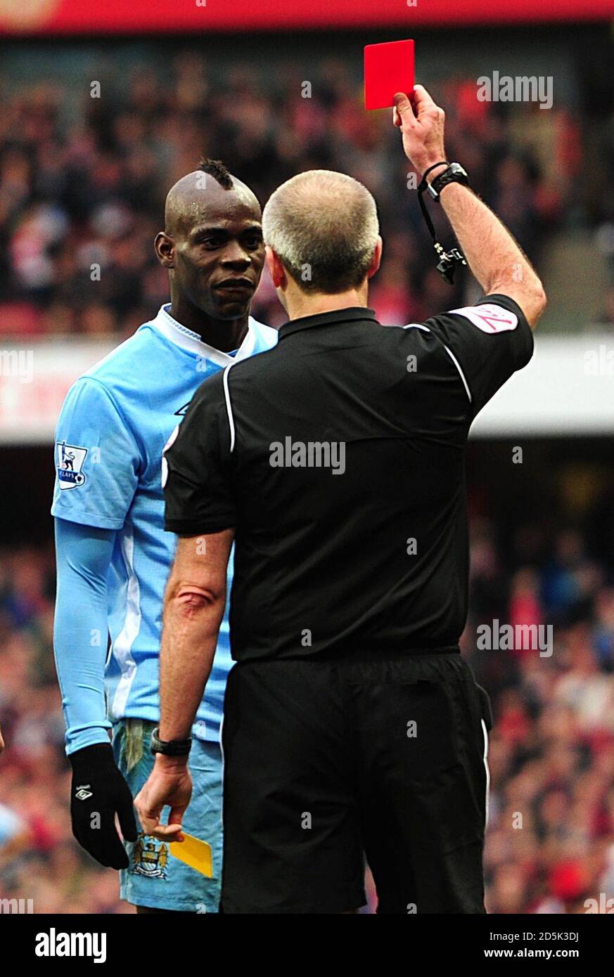 Manchester City's Mario Balotelli is shown the red card by referee ...