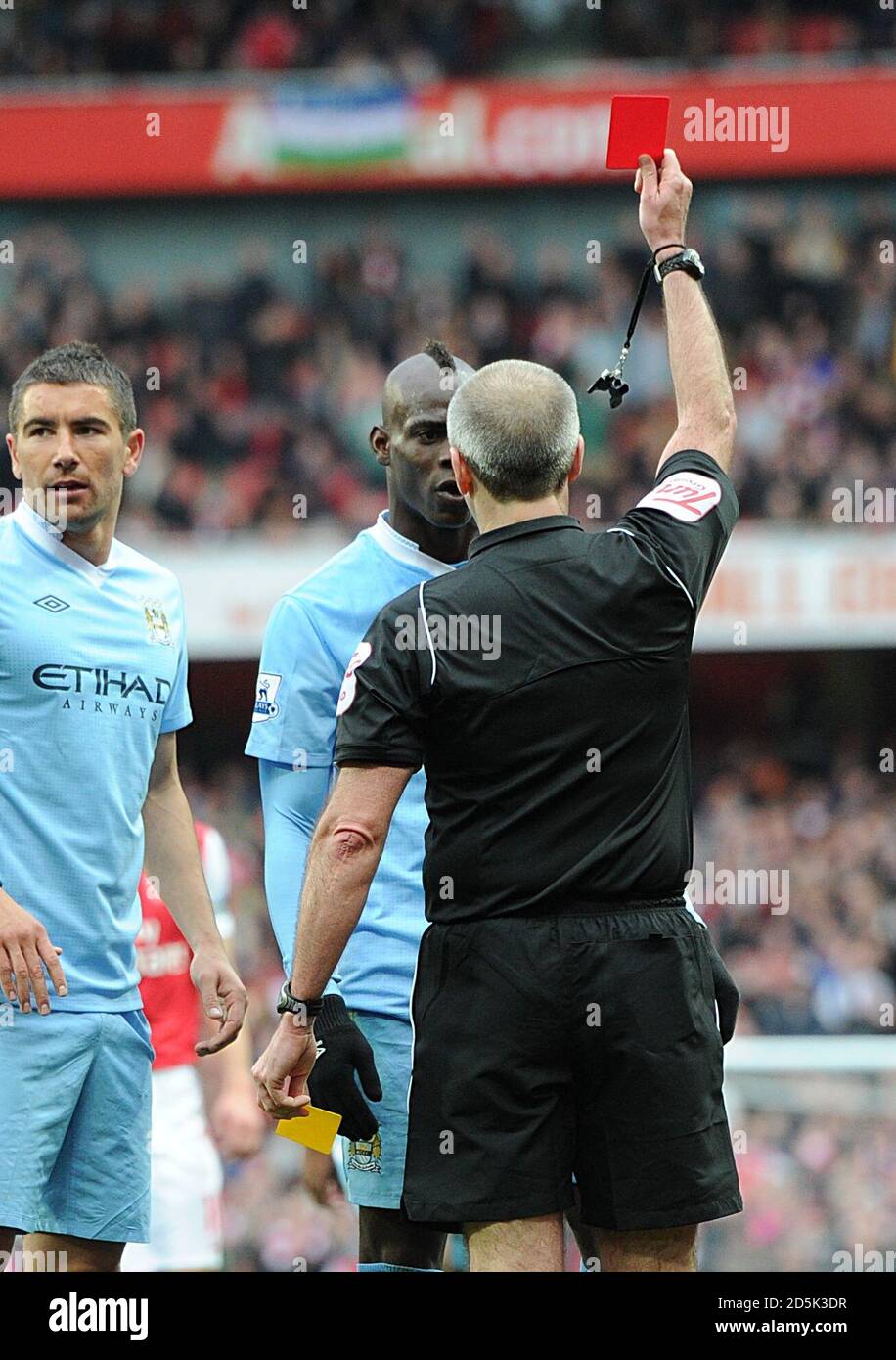 Manchester City's Mario Balotelli is sent off by referee Martin ...
