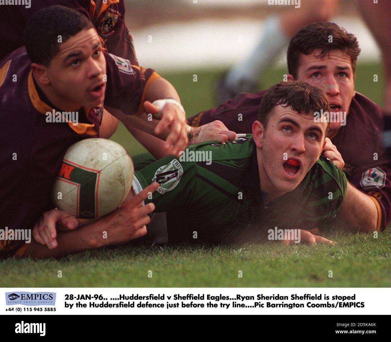 Ryan Sheridan, Sheffield Eagles is stopped by the Huddersfield defence ...
