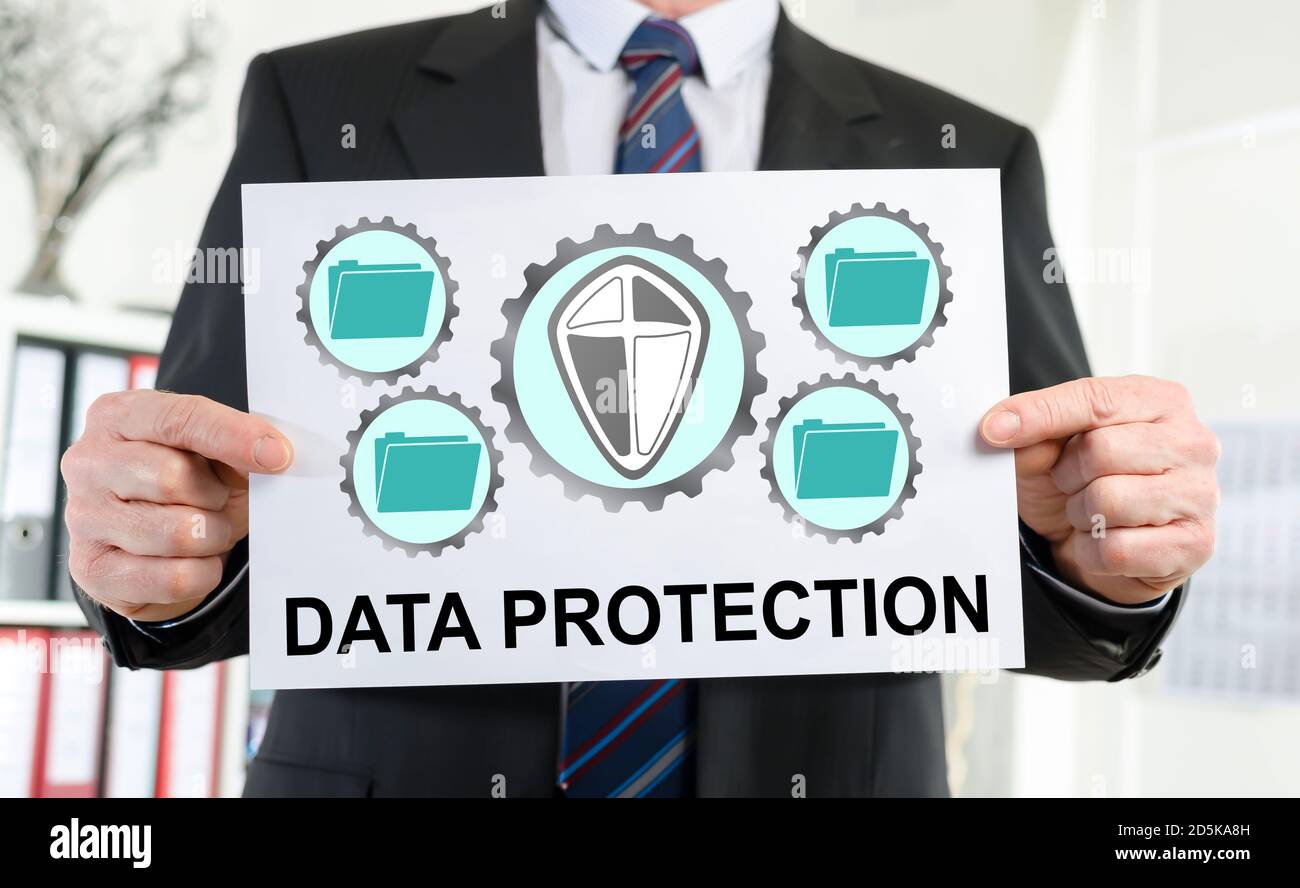 Paper showing data protection concept held by a businessman Stock Photo ...