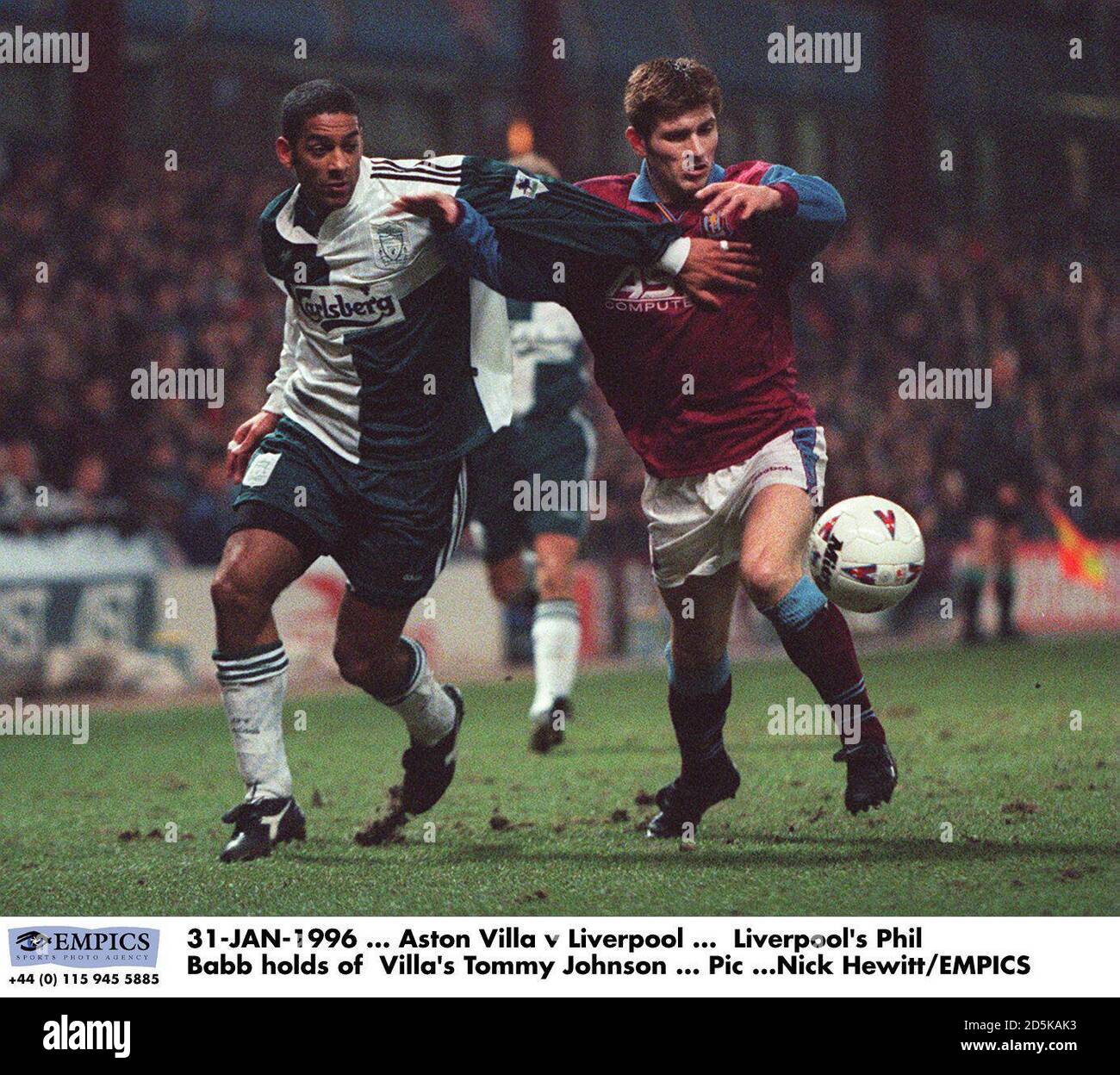 Liverpool's Phil Babb holds off Aston Villa's Tommy Johnson Stock Photo ...