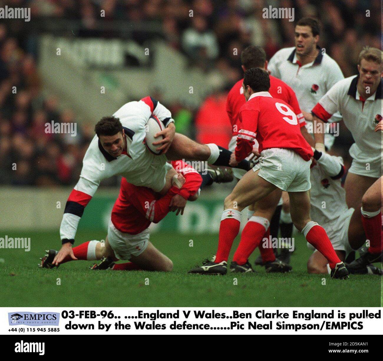 Ben Clarke (England) is pulled down by the Welsh defence Stock Photo ...
