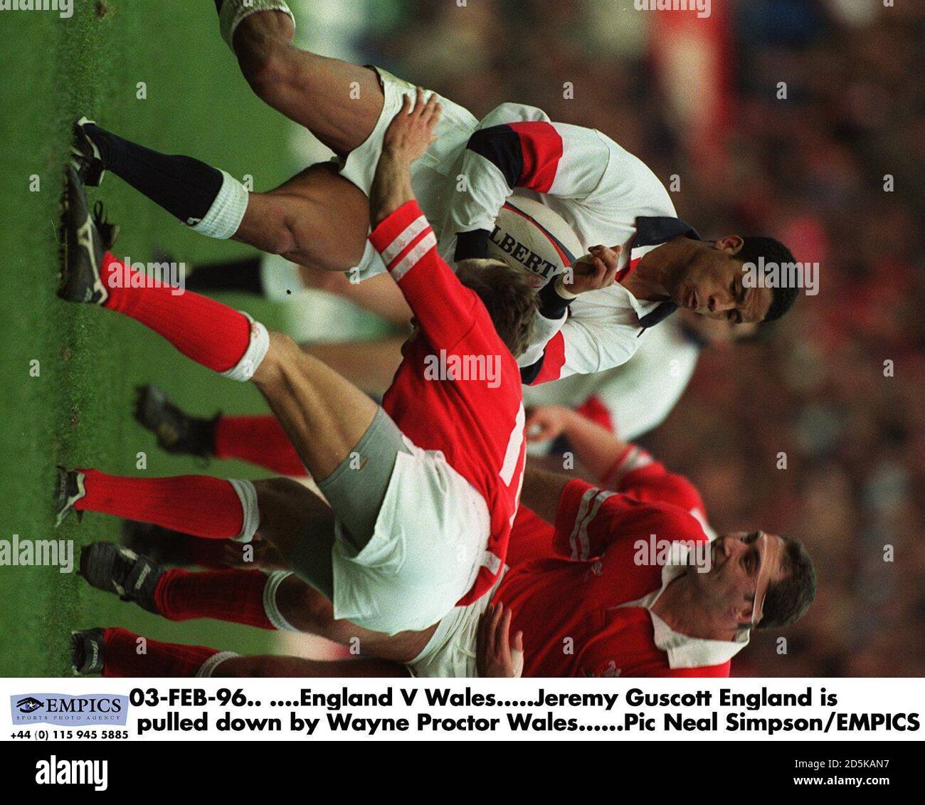 03-FEB-96. ....England v Wales. Jeremy Guscott (England) is pulled down ...