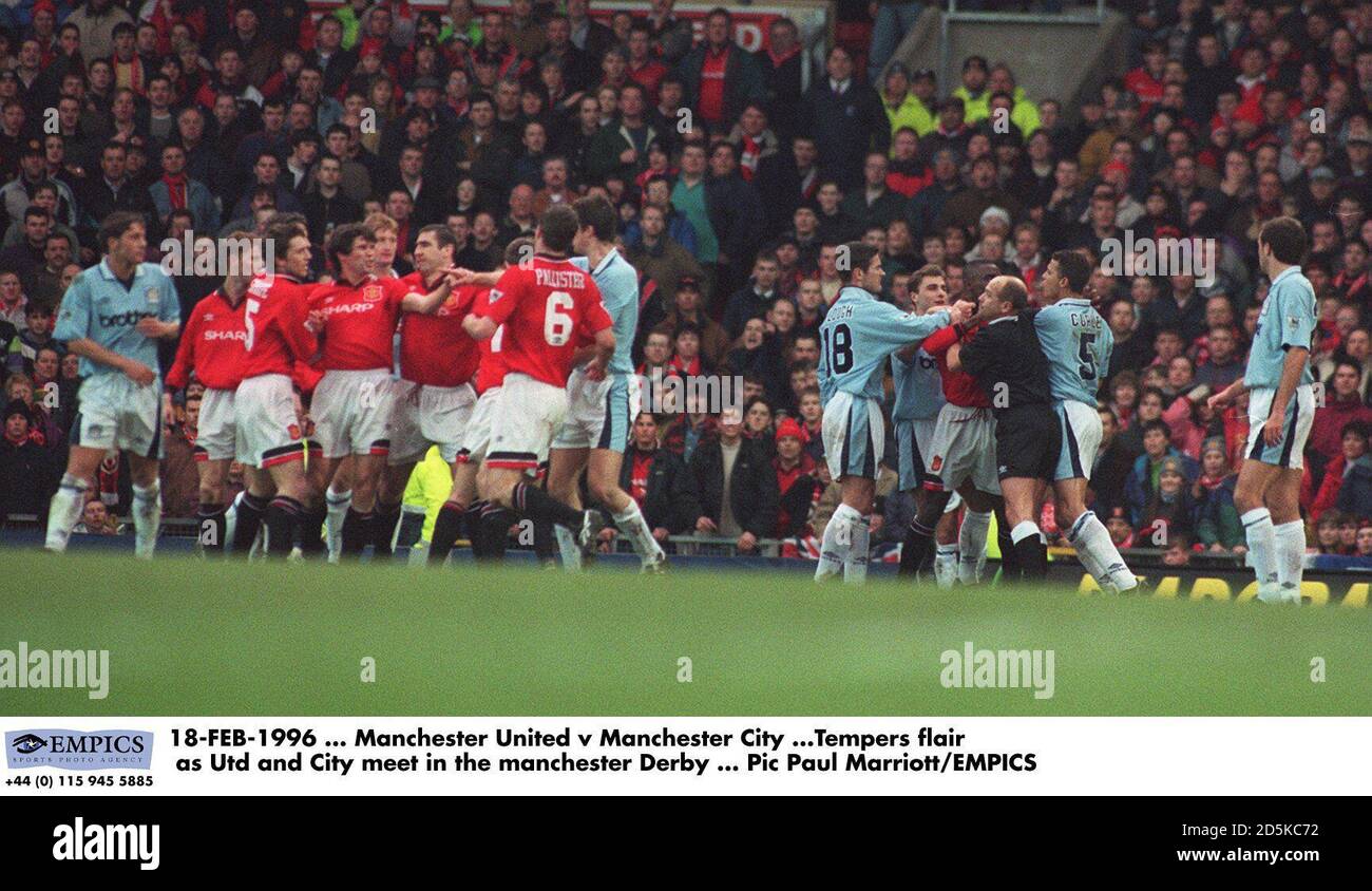 Manchester United and City players fight despite referee Alan Wilkie's ...