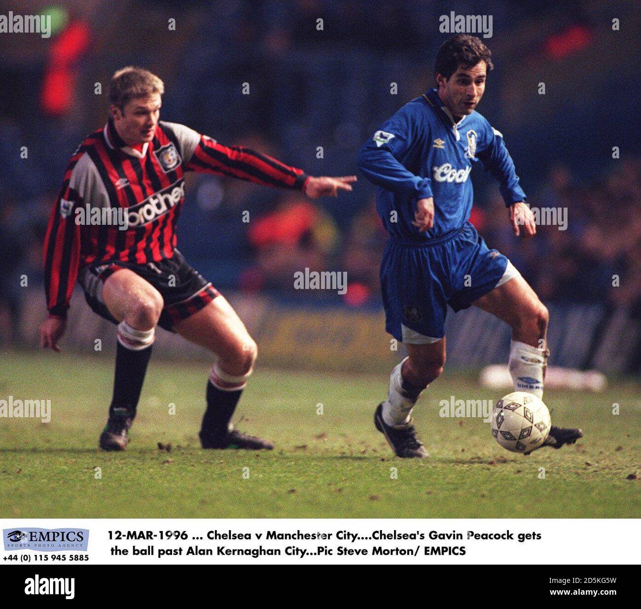 12-MAR-96. Chelsea's Gavin Peacock gets the ball past Alan Kernaghan ...