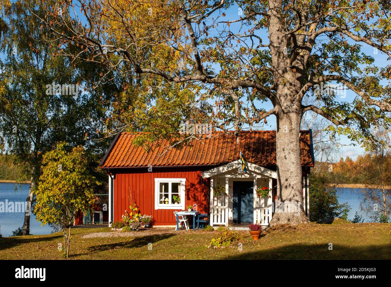 Idyllic red cottage porch hi-res stock photography and images - Alamy