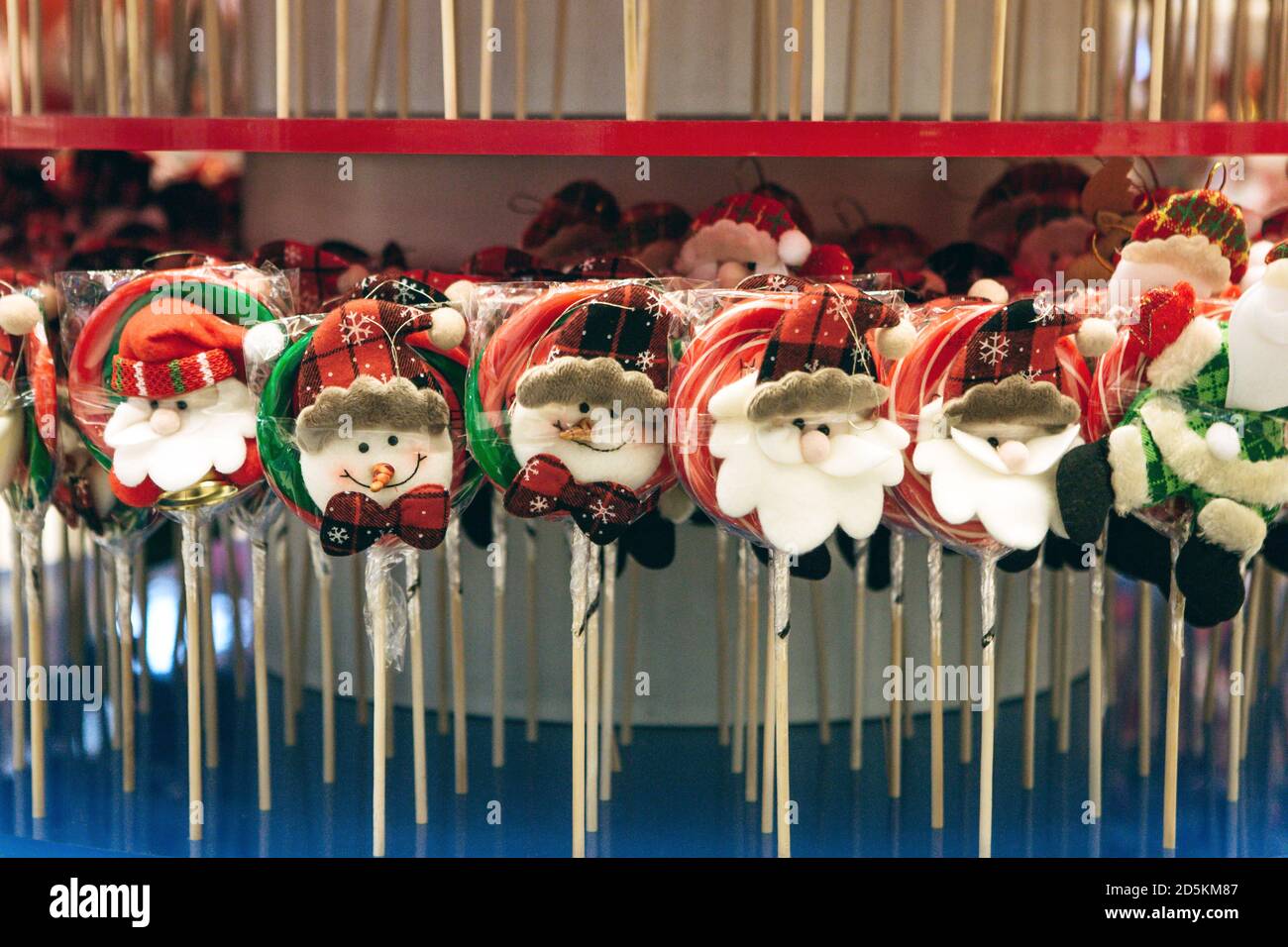 Traditional Christmas lollipops in a row at a Christmas market or shop ...