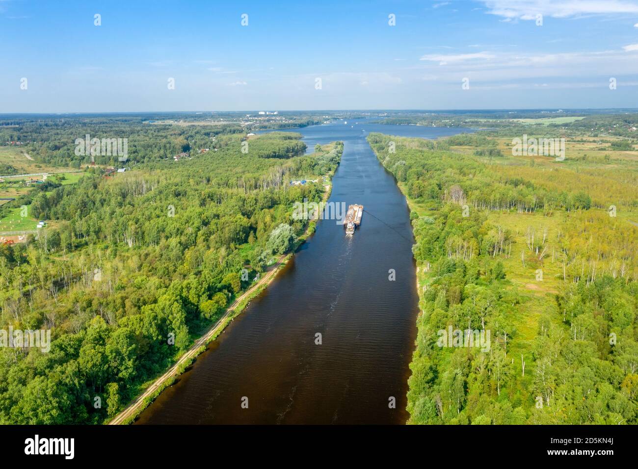 Top view of a water channel and a moving barge Stock Photo - Alamy
