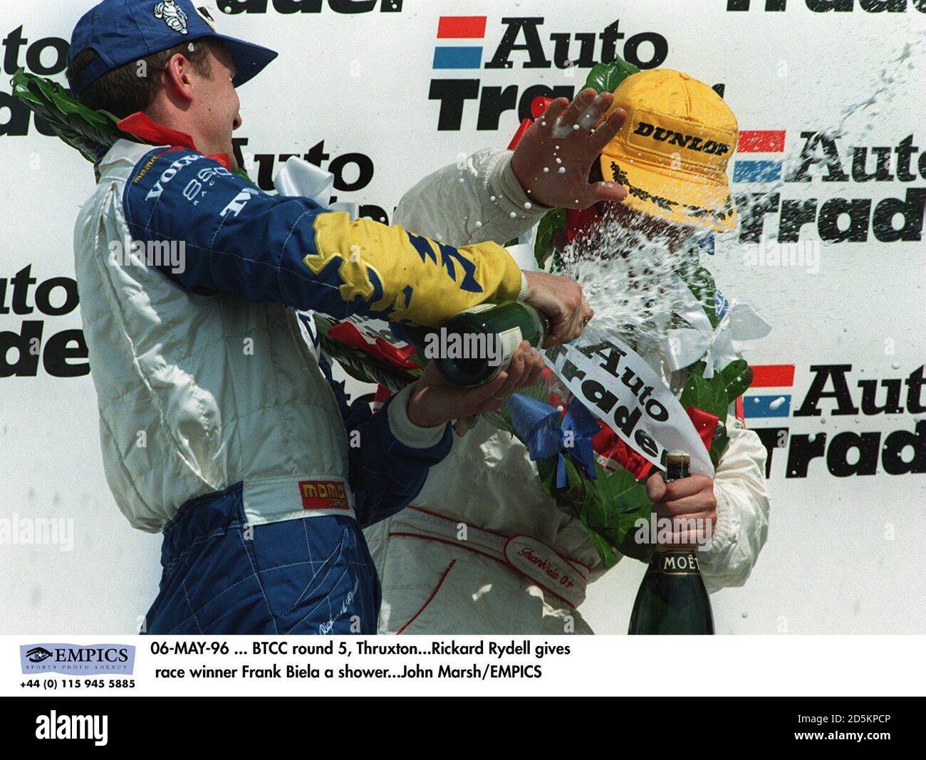 Rickard Rydell gives race winner Frank Biela a shower Stock Photo - Alamy