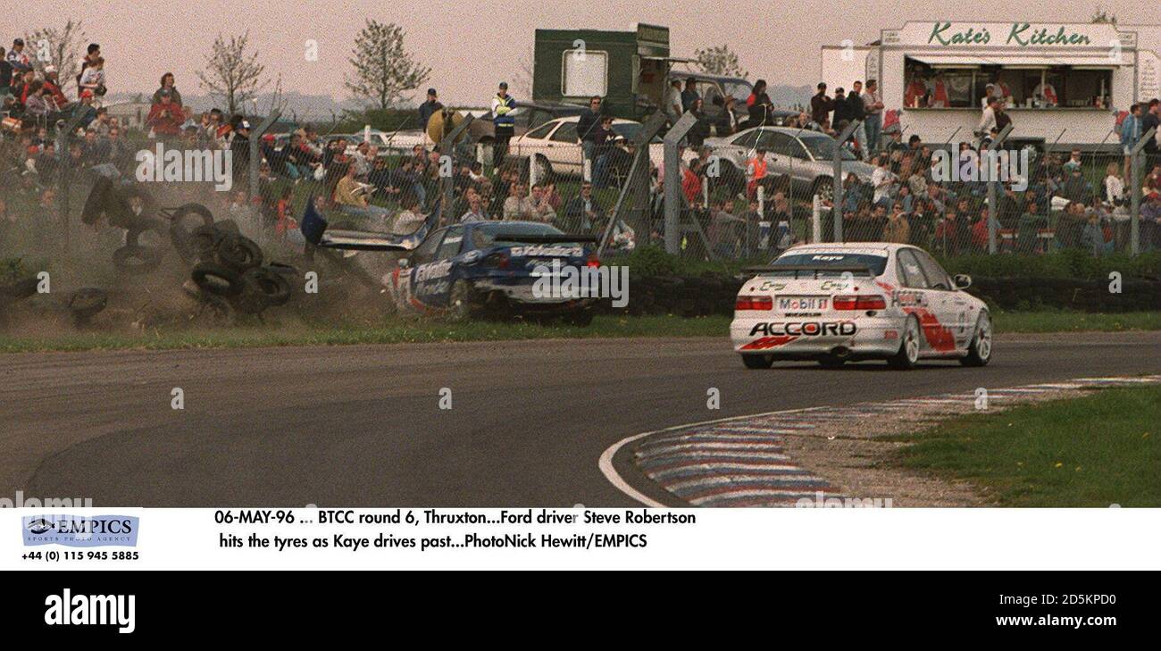 Ford driver Steve Robertson hits the tyres as Kaye drives past Stock ...
