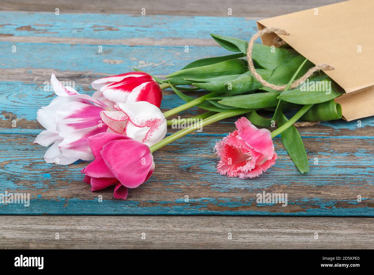 Tulips flowers bouquet of wooden boards as a background Stock Photo - Alamy