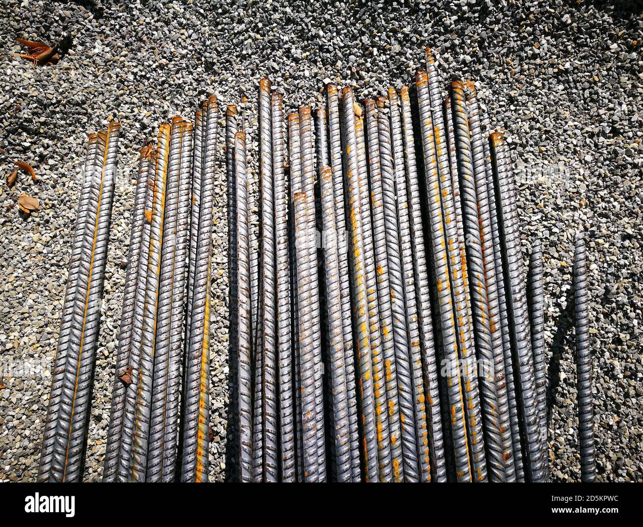 Top view shot of steel bars on the ground for construction Stock Photo ...