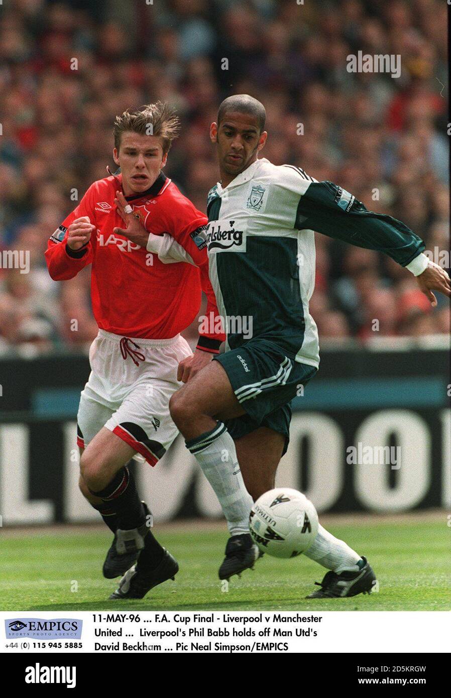 Liverpool's Phil Babb holds off Manchester United's David Beckham Stock ...