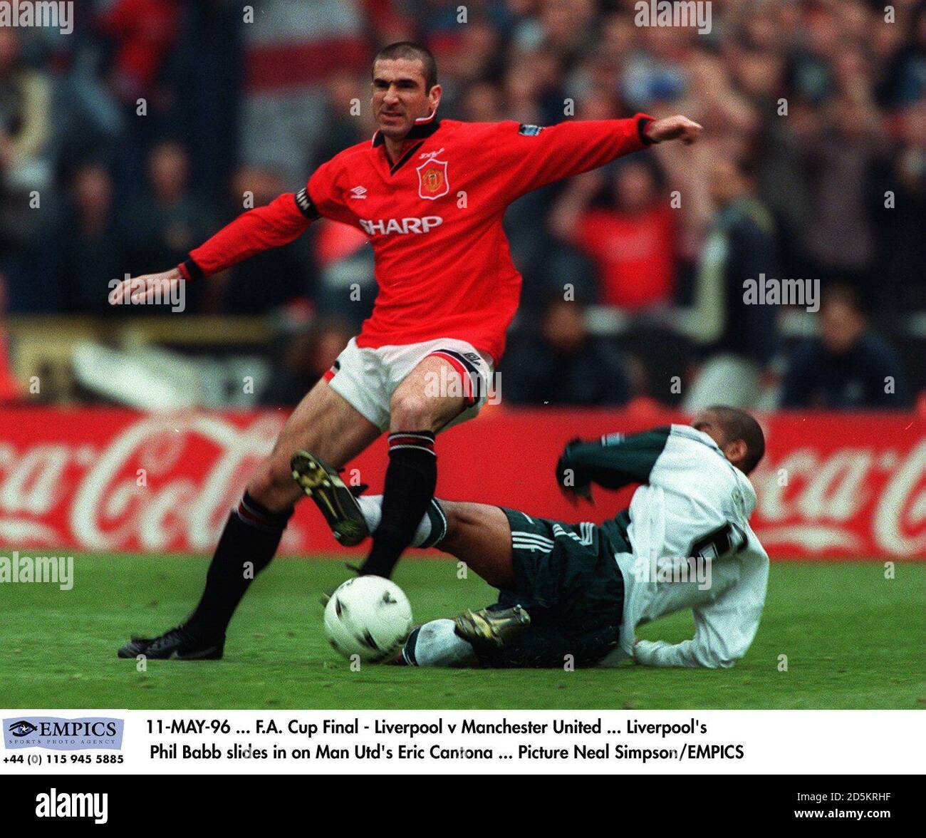 Liverpool's Phil Babb slides in on Manchester United's Eric Cantona ...