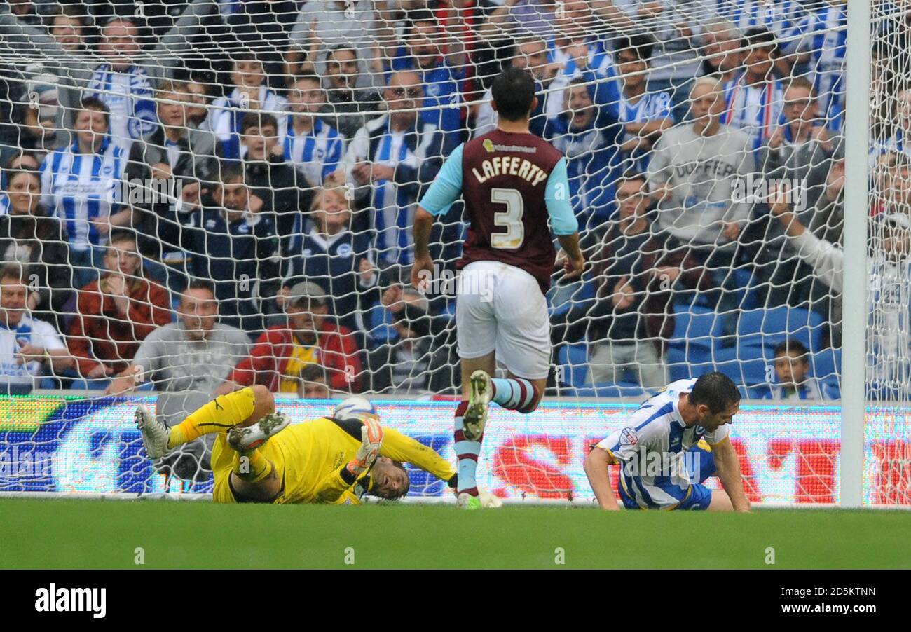 Brighton and Hove Albion's Andrew Crofts (right) scores his side's ...