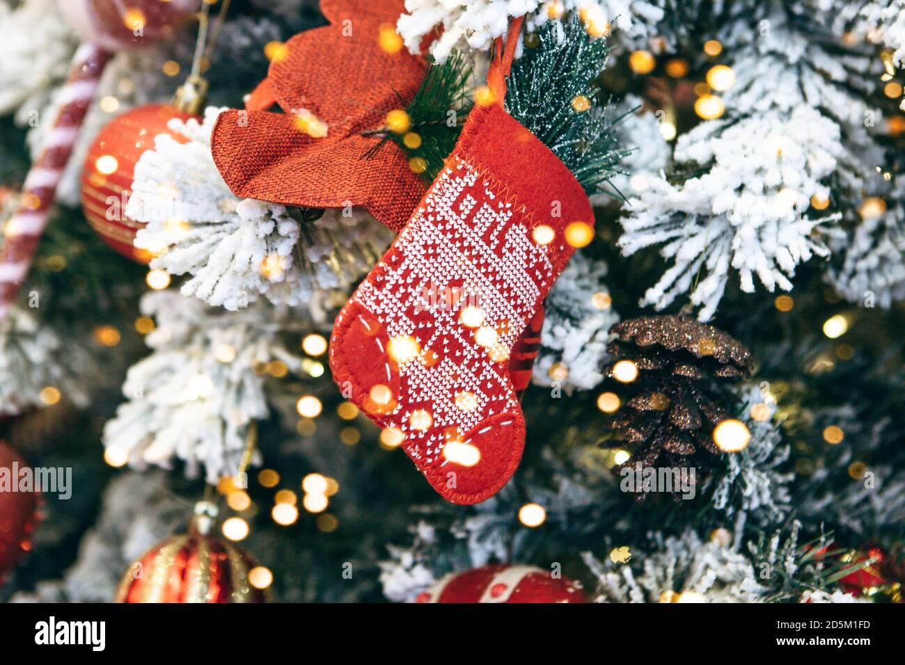 Christmas stocking on a Christmas tree and other decoration background ...