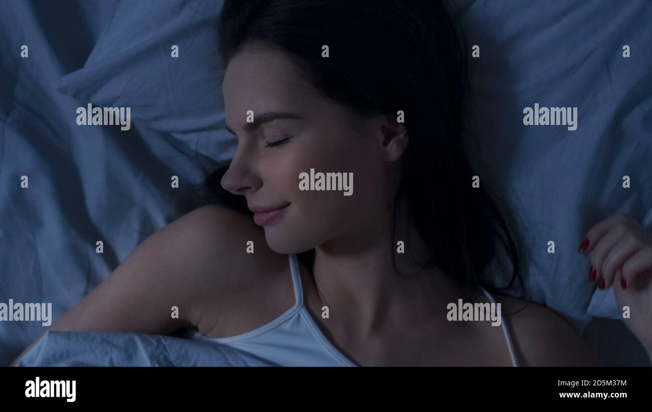 Portrait of Beautiful Young Brunette Charmingly Sleeping in Her Bed in ...