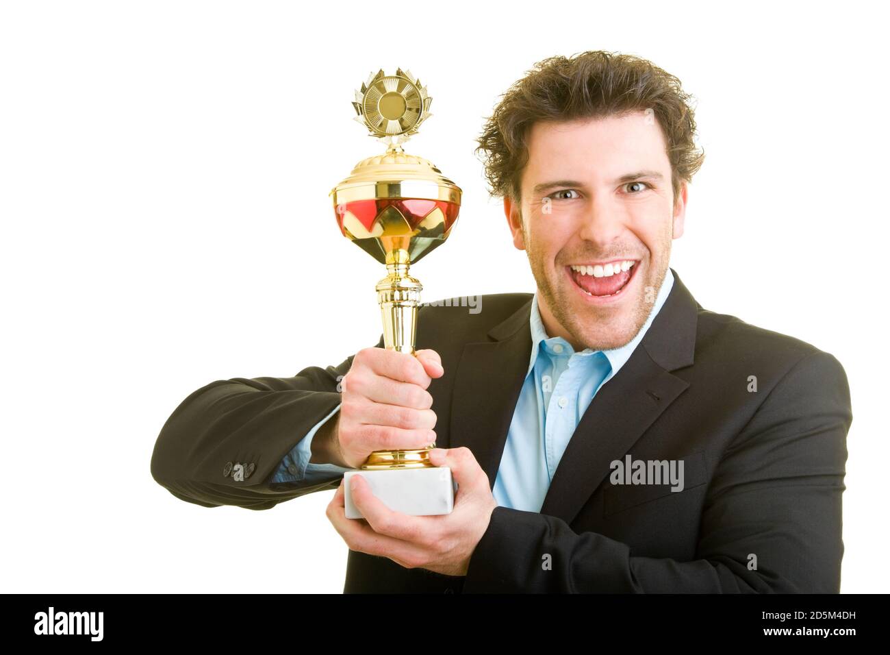 Young man in business clothes proudly celebrates with a trophy Stock ...