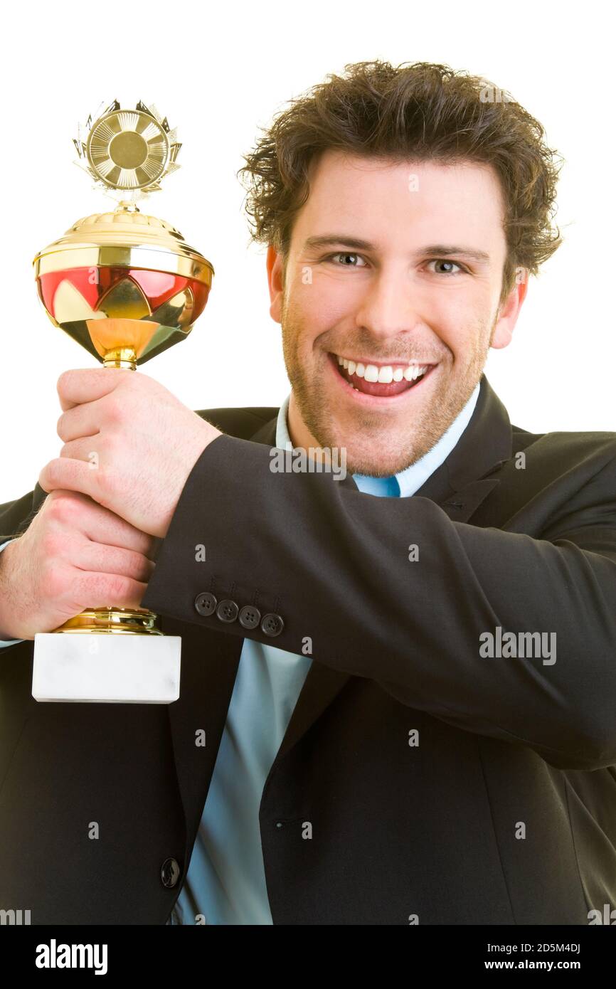 Young man in business clothes proudly celebrates with a trophy Stock ...