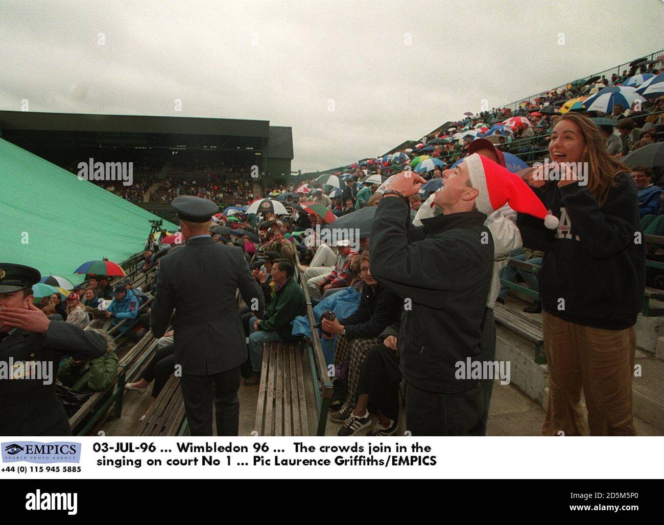 03-JUL-96 ... Wimbledon 96 ... The crowds join in the singing on court ...