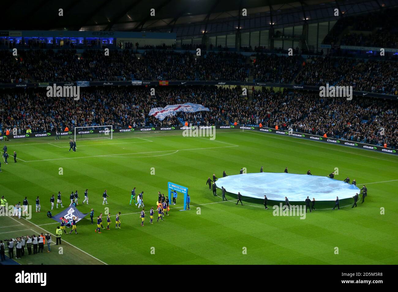 The two teams walk out onto the pitch before kick-off Stock Photo - Alamy