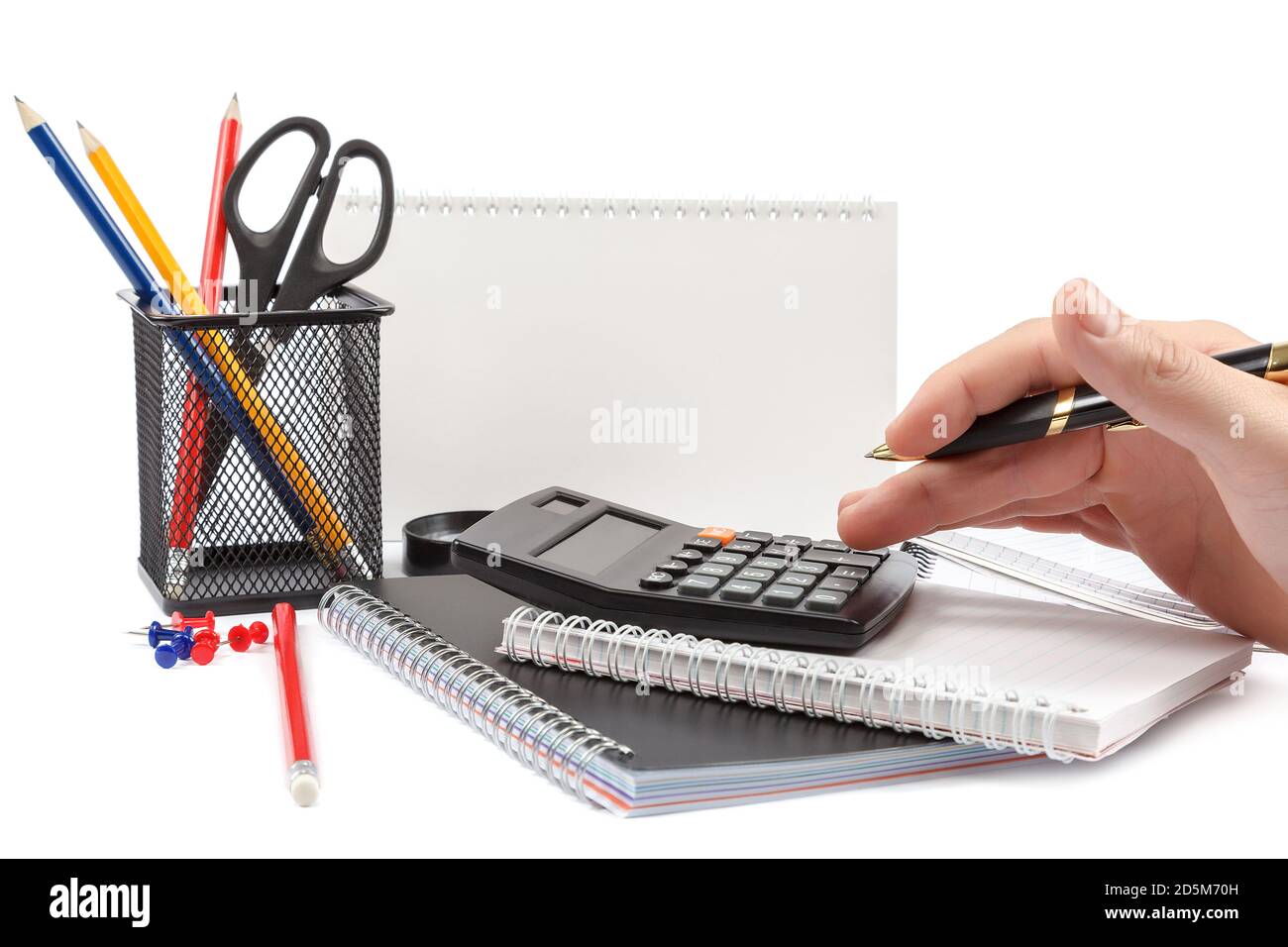 Hand with pen and office accessories isolated on a white background ...