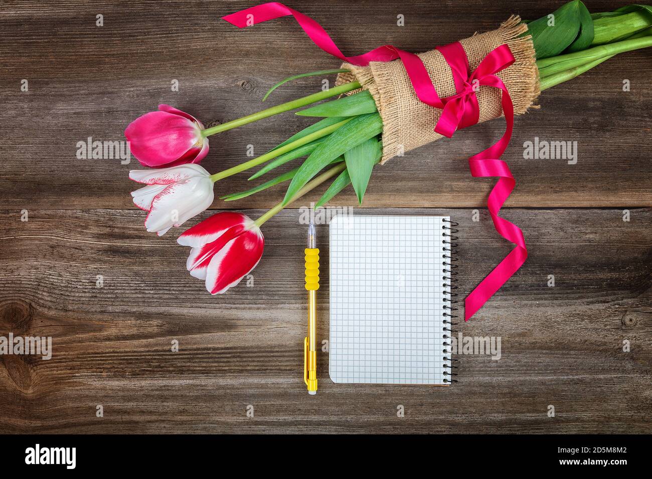 Tulips flowers bouquet of wooden boards as a background Stock Photo - Alamy
