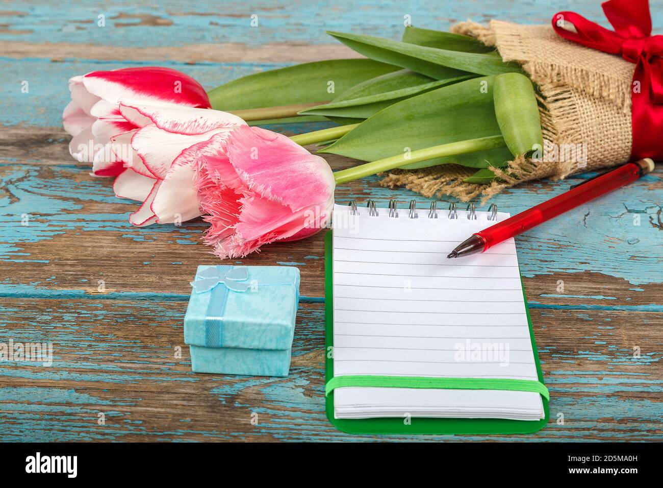 Tulips flowers bouquet of wooden boards as a background Stock Photo - Alamy