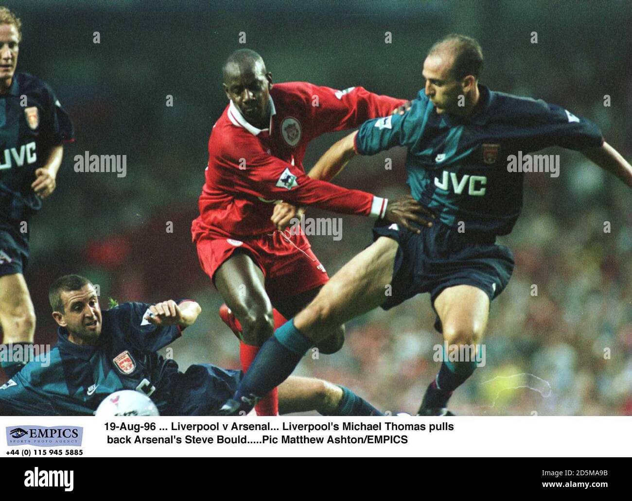 Liverpool's Michael Thomas pulls back Arsenal's Steve Bould Stock Photo ...