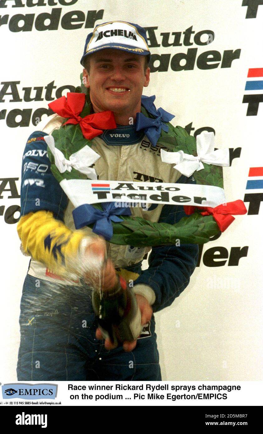 Race winner Rickard Rydell sprays champagne on the podium Stock Photo ...