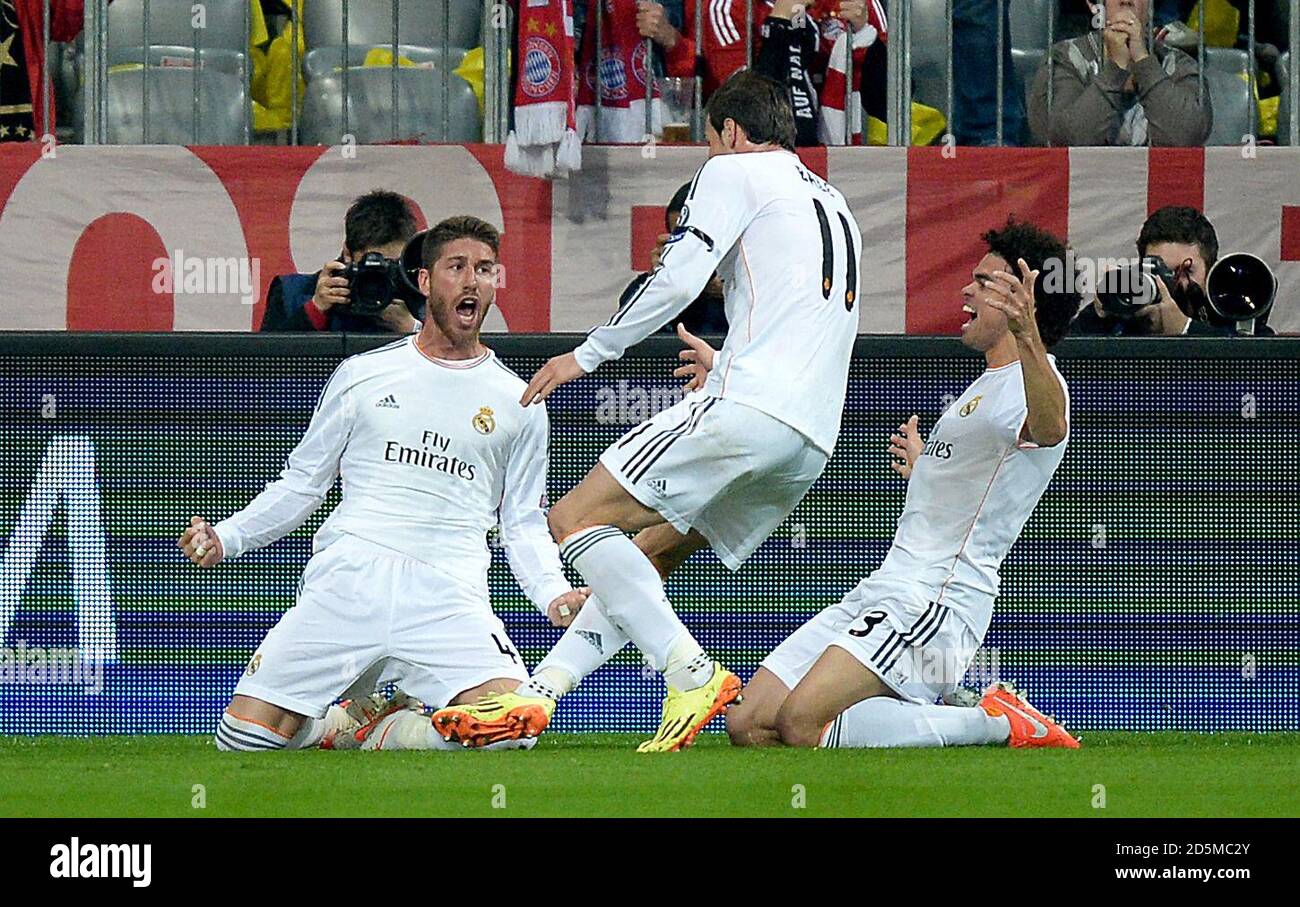 Real Madrid's Sergio Ramos (left) celebrates scoring his side's first ...