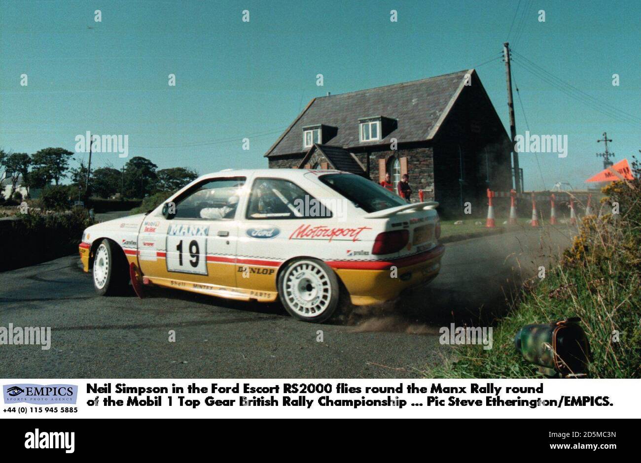 Neil Simpson in the Ford Escort RS2000 flies round the Manx Rally round ...