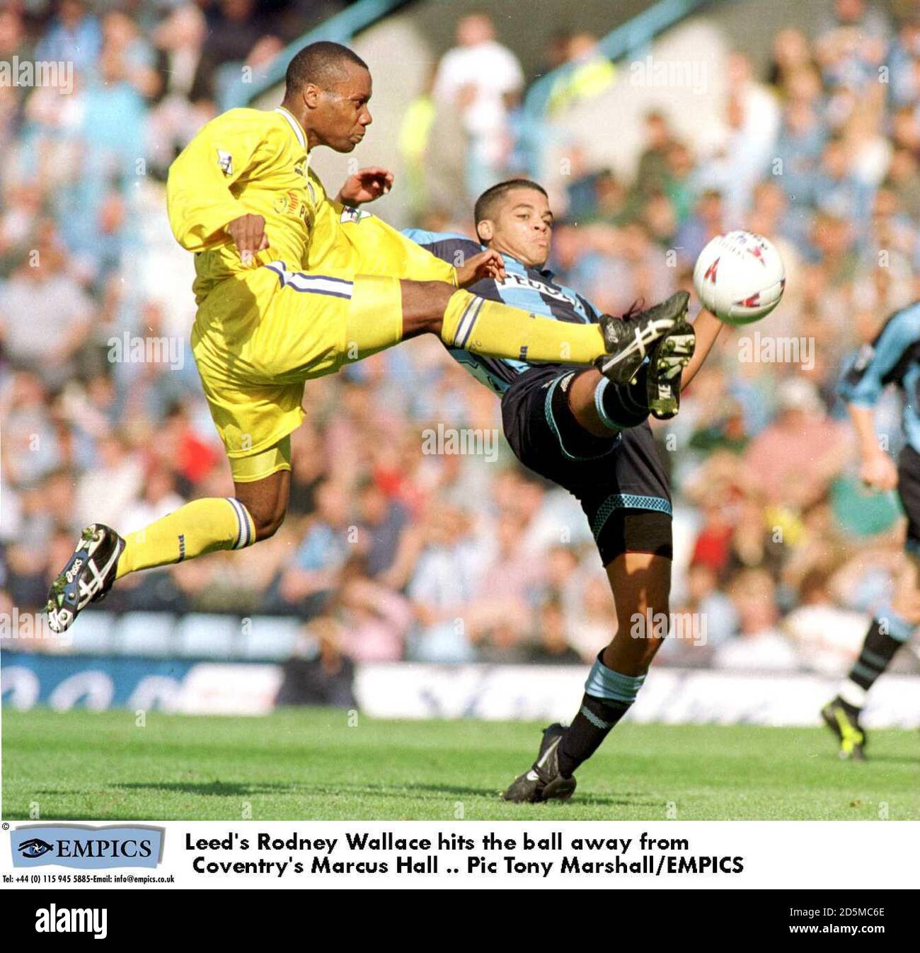 Leed's Rodney Wallace hits the ball away from Coventry's Marcus Hall ...
